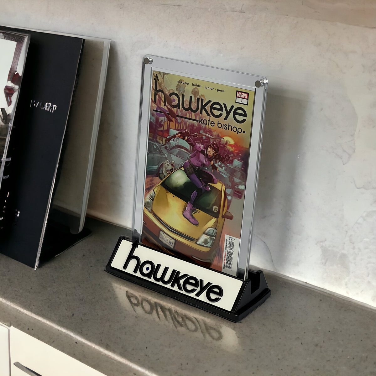 Hawkeye Comic Stand – Red Wolf Collectibles