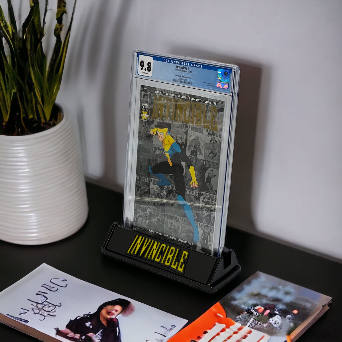 Invincible Comic Stand (Black and Yellow) – Red Wolf Collectibles