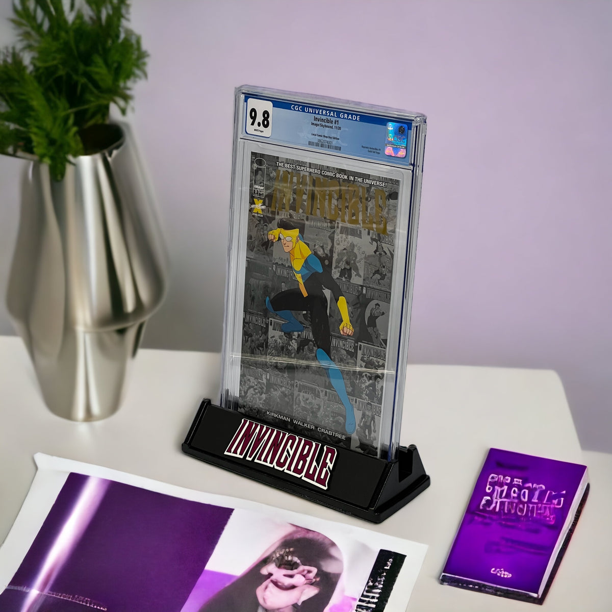 Invincible Comic Stand (Purple and White) – Red Wolf Collectibles